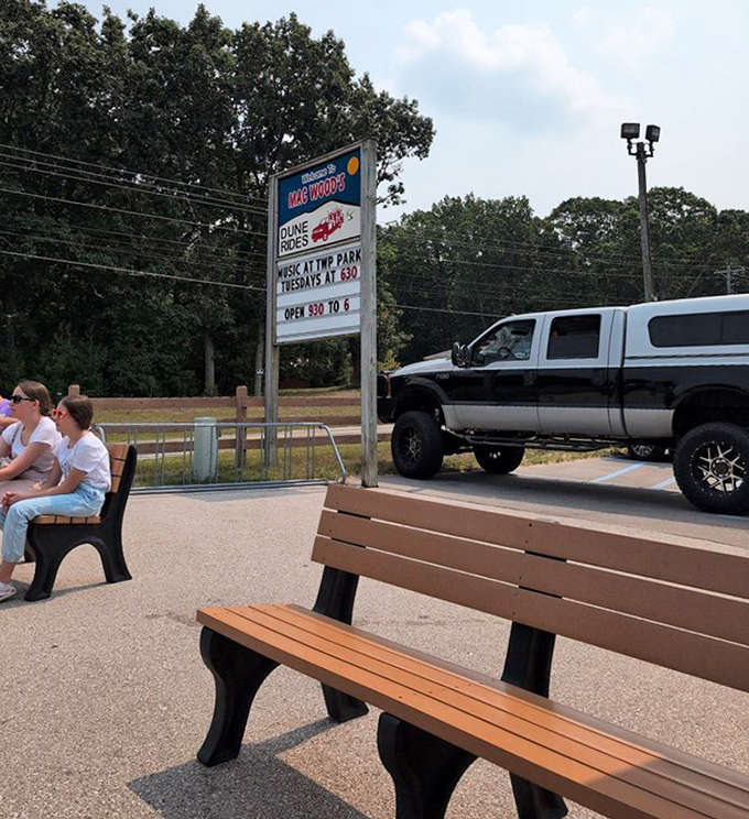The unassuming sign promises simple pleasures – music in the park and dune adventures that don't require a smartphone app.