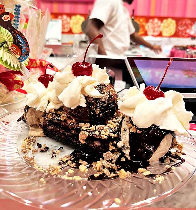 Architectural dessert genius &ndash; a skyscraper of chocolate, cream, and cherries that deserves its own zip code.