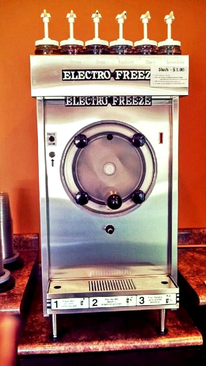 The Electro Freeze machine: mechanical wizard that transforms ordinary liquids into slush magic worthy of a summer celebration.