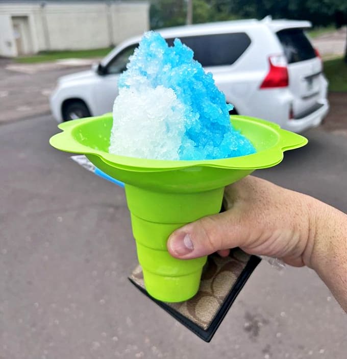 Snow Cone: A refreshing blue and white mountain of shaved ice that brings back childhood memories while cooling you down on hot Minnesota afternoons.
