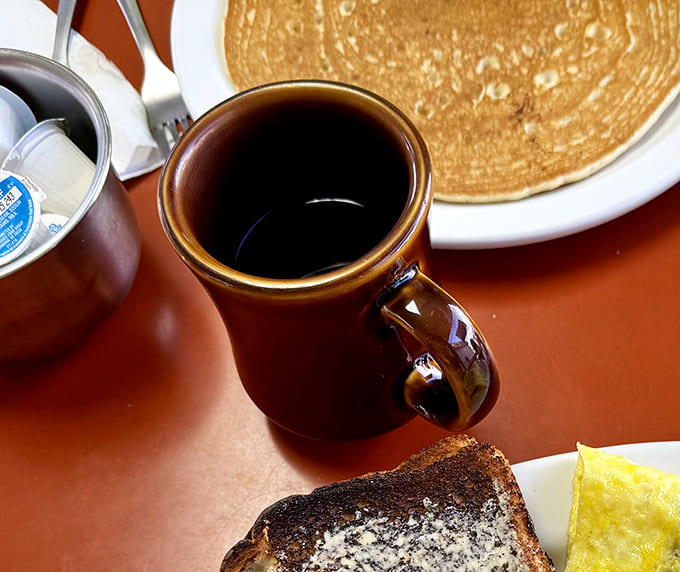 The coffee comes in these sturdy mugs that somehow make everything taste better &ndash; like drinking from your favorite aunt's kitchen.
