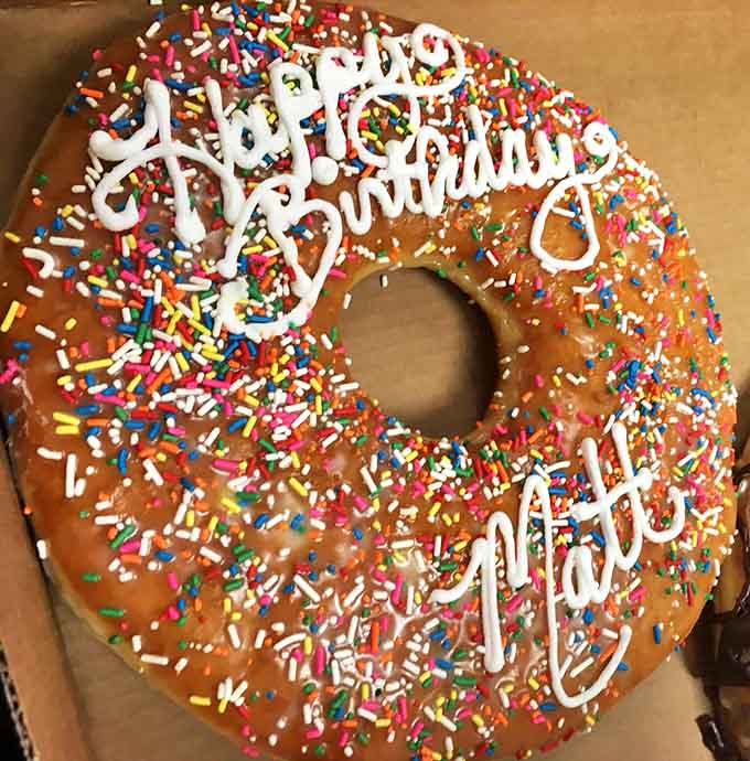 This birthday donut is basically a party you can hold in your hand, sprinkles and all.