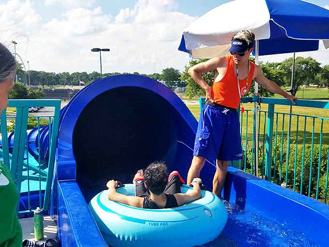 The starting platform of the water slide where brave souls make the split-second decision between glory and "what was I thinking?"
