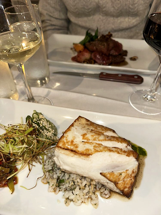 The choice between perfectly cooked steak and fresh halibut is the kind of delicious dilemma that makes dining out feel like winning.