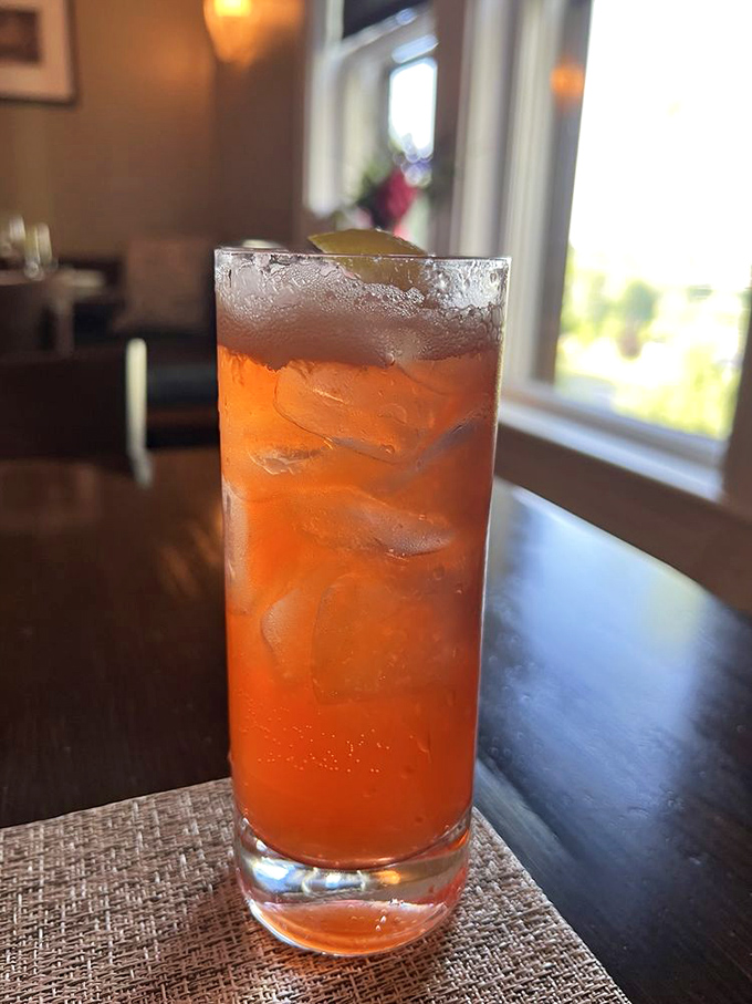 This vibrant cocktail, garnished with edible flowers from the garden, tastes like summer in Maine captured in a glass.