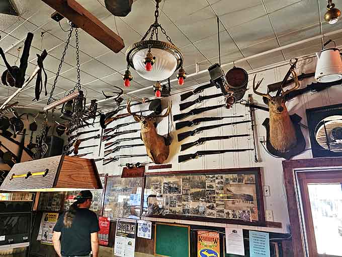 Rifles, antlers, and historical photographs create a tapestry of local history on the walls &ndash; each item with its own story waiting to be told.