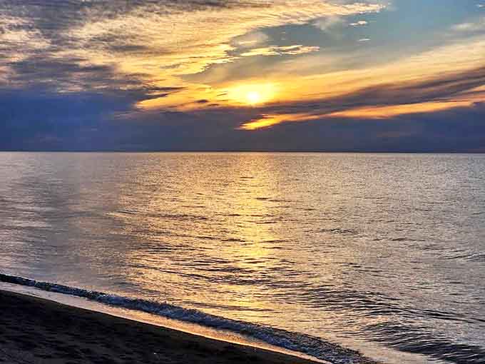 Sunset at North Canal Township Park: The sun bids farewell in spectacular fashion, painting the water with molten gold that ripples to the horizon.