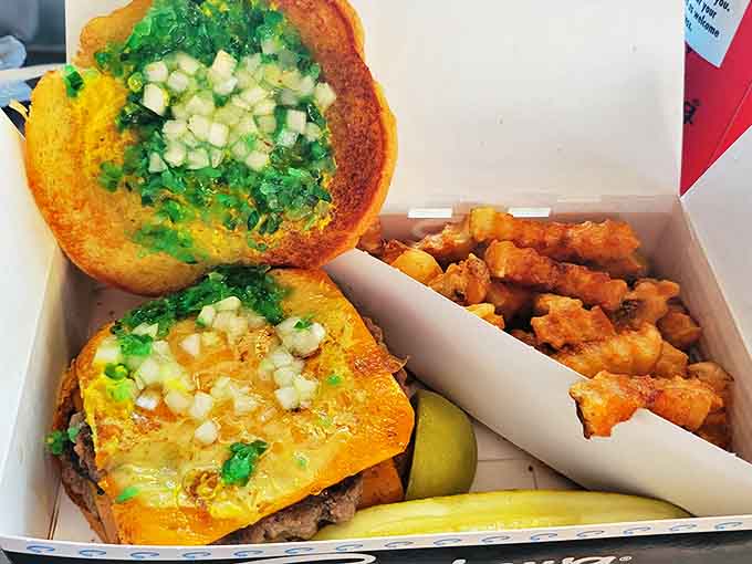 Beyond hot dogs, Superdawg's burger offerings come packed with flavor and nostalgia, served in the same iconic blue boxes.