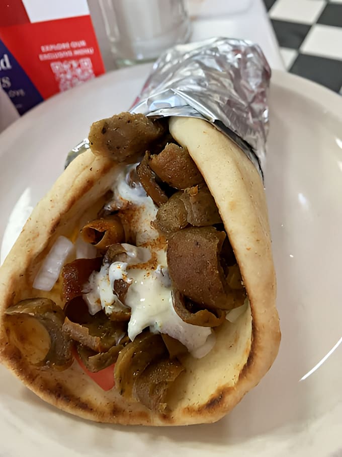 The Gyro wrap offers a Mediterranean vacation in handheld form &ndash; seasoned meat, fresh vegetables, and creamy tzatziki sauce wrapped in warm, pillowy pita bread.