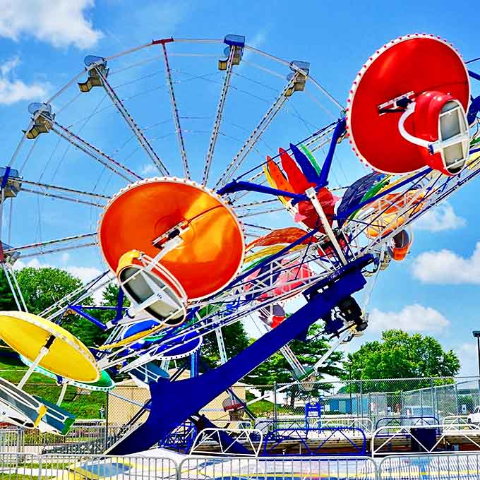 The Paratrooper ride spins visitors in colorful orbits, creating that perfect mixture of delight and mild regret that defines classic amusement parks.