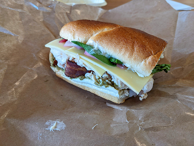 The classic turkey club demonstrates sandwich engineering at its finest &ndash; triple-decker construction that somehow stays together until the last bite.