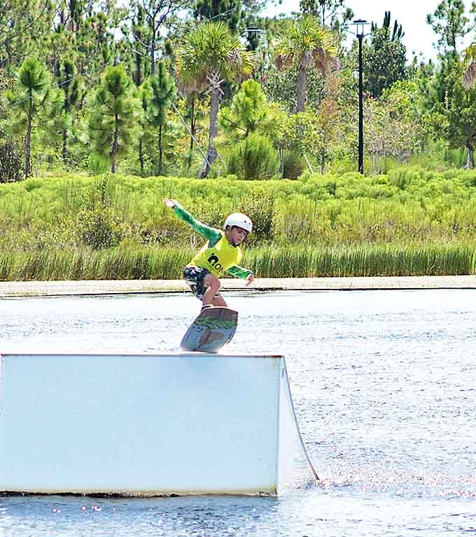 A young wakeboarder demonstrates that gravity is merely a suggestion when you've got enough speed and the perfect ramp.