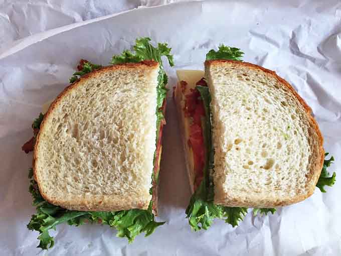 Not just a sandwich but an architectural marvel of fresh ingredients between bread that puts ordinary loaves to shame.