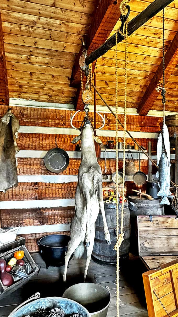 Frontier food preservation on full display &ndash; that hanging deer wasn't just decoration, it was tomorrow's dinner for hungry soldiers.