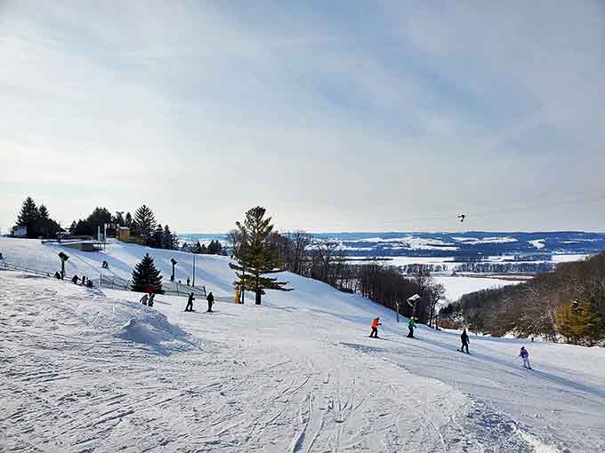 Winter transforms Bingham Falls into a crystalline sculpture garden where flowing water defies freezing temperatures in spectacular fashion.