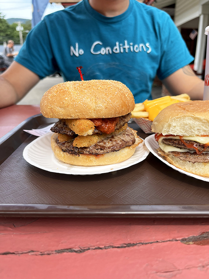 This isn't just a burger &ndash; it's architecture, engineering, and culinary art stacked between two buns and secured with a toothpick flag.