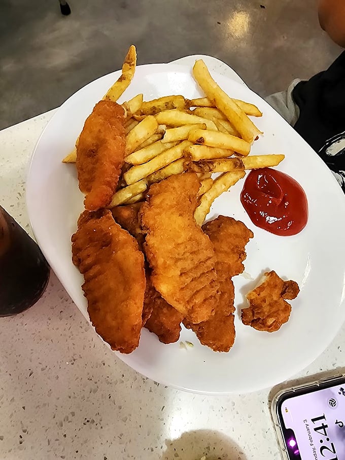 Golden-battered chicken strips and perfectly cooked fries &ndash; proof that sometimes the simplest pleasures are the most satisfying.