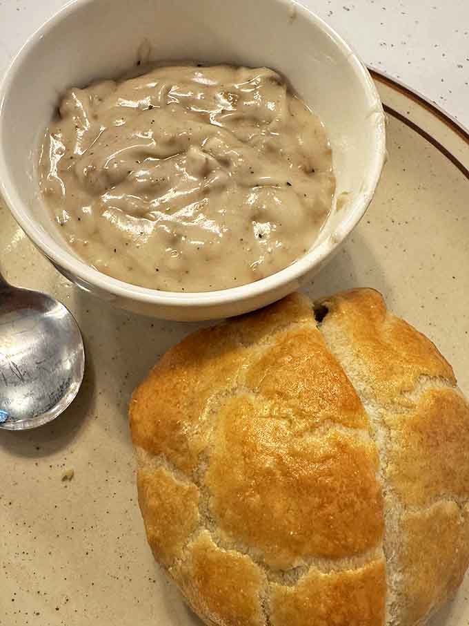 A bowl of clam chowder thick enough to stand a spoon in, served with bread that's practically begging to sop up every last creamy drop.