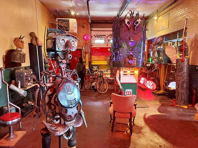 Delicate paper flowers bloom eternally on this dress form, a softer counterpoint to the predominantly metallic sculptures throughout the gallery.