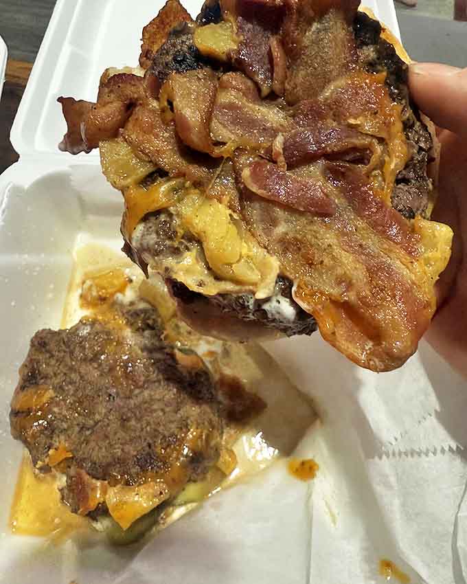 This isn't just a burger &ndash; it's a masterpiece of beef, cheese, and toppings that requires both hands and several napkins.