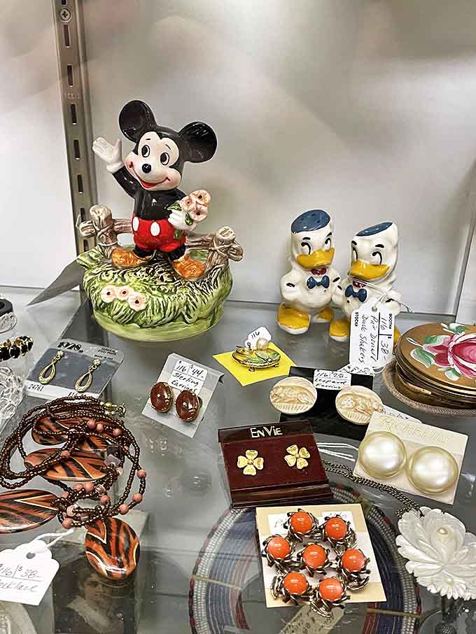 Mickey Mouse and his Disney friends stand guard over vintage jewelry, proving that some childhood icons never lose their charm or collectible value.