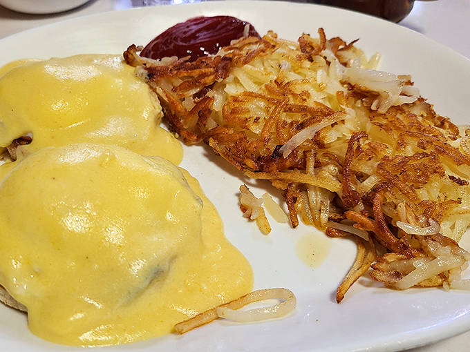 Eggs Benedict & Hash Browns Hollandaise cascading over perfectly poached eggs while those crispy hash browns wait patiently for their moment to shine.