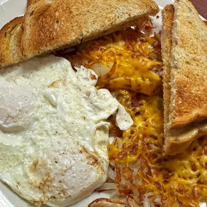 The breakfast trinity &ndash; perfectly cooked eggs, crispy-edged hash browns, and toast that somehow tastes better than what you make at home.