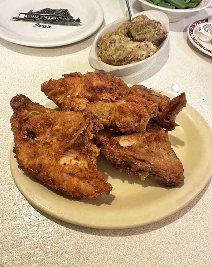 Southern fried chicken perfection: crispy exterior giving way to juicy meat that practically falls off the bone. Resistance is futile.
