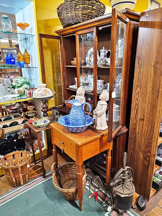 A perfectly staged vignette of home d&eacute;cor that makes you wonder if your house needs more blue ceramic and vintage textiles. (Spoiler: it does.)