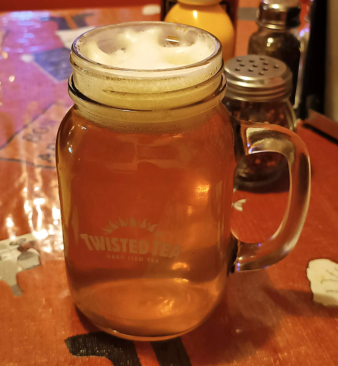 Amber refreshment served in a mason jar &ndash; the perfect companion to spice-laden pizza adventures on hot Arizona afternoons.