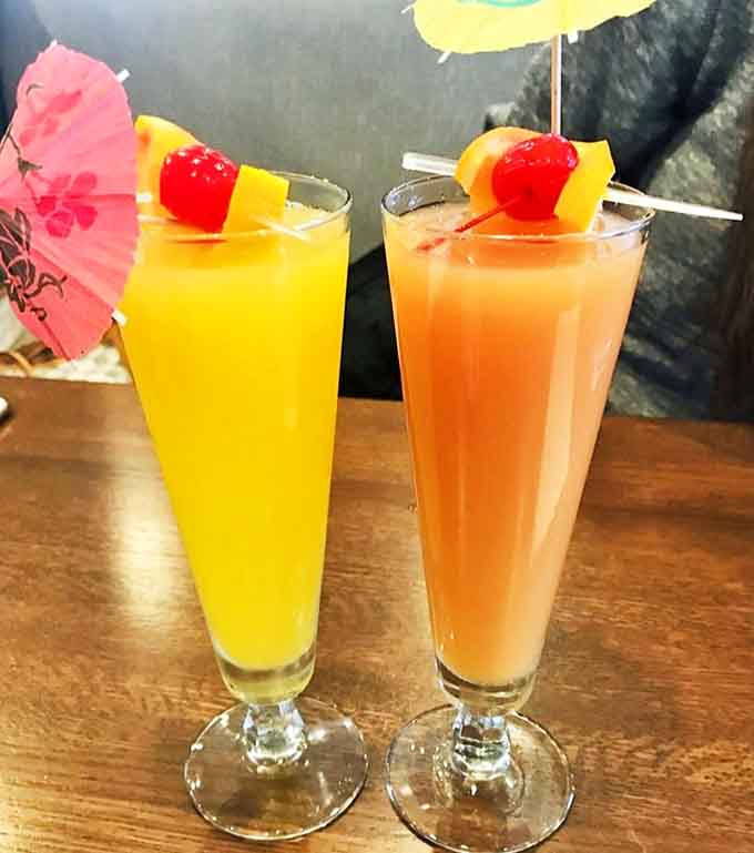 Festive mimosas garnished with fresh fruit add a touch of celebration to any morning, because why not?