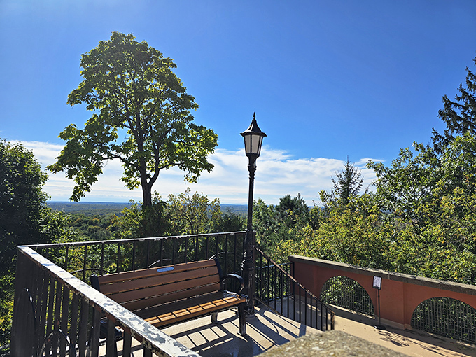 A peaceful bench awaits contemplative visitors, offering panoramic views that stretch to the horizon and change with each passing season.