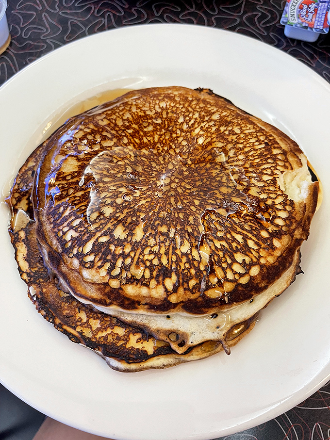 Pancakes so perfectly golden they could be used as currency in some delicious alternate universe where maple syrup flows like water.