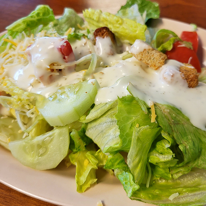 The salad bar offerings are fresh and vibrant, with house-made dressing that complements without overwhelming the crisp vegetables.