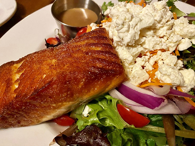 Crispy-skinned salmon perched atop a colorful salad demonstrates why seafood in the mountains can be just as impressive as by the coast.
