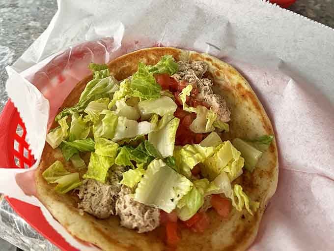 A garden of freshness adorns this house salad, proving vegetables can be more than just an obligation at a comfort food haven.