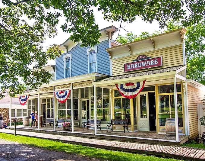 The village storefronts create a perfect movie-set vision of Americana, complete with patriotic bunting and the promise of penny candy within.