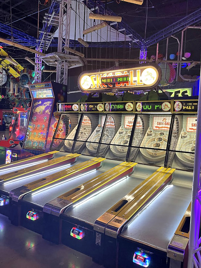 The indoor ropes course challenges brave souls to navigate suspended pathways while friends below offer "helpful" commentary.