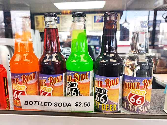Those vintage Route 66 sodas in glass bottles add another layer of nostalgia to an already time-traveling dining experience.