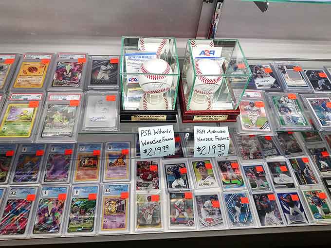 Baseball cards and memorabilia capture moments of sporting glory, preserved under glass for future generations of fans.