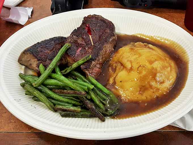 When your steak comes with green beans and a baked potato, you're looking at a complete meal that understands balance and satisfaction.
