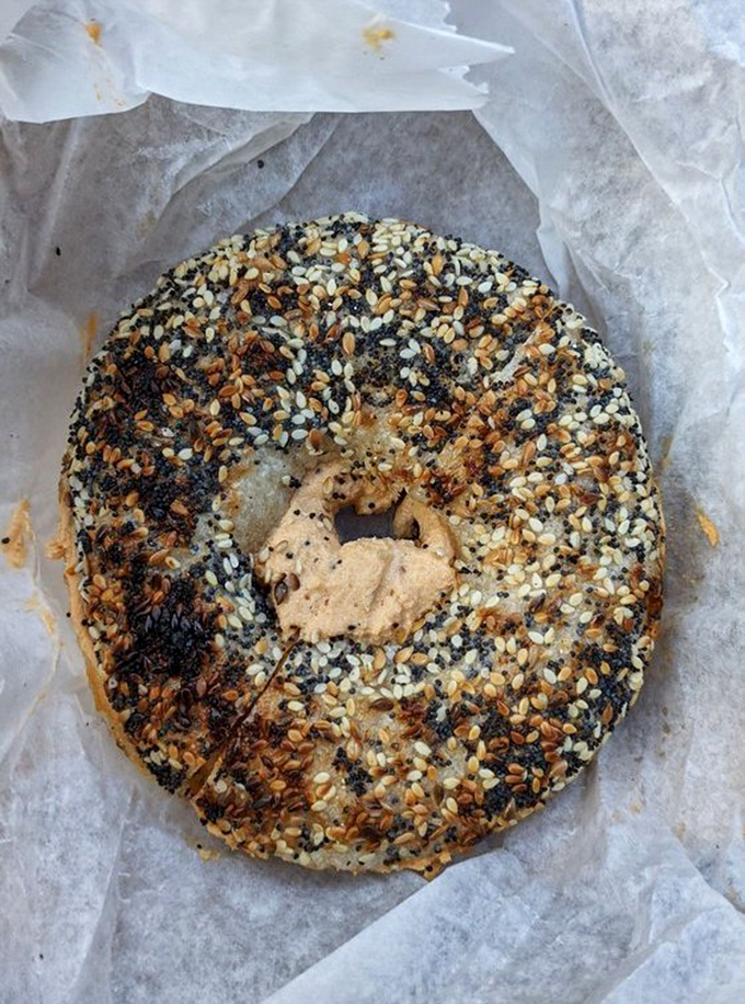 A dollop of heaven awaits in that bagel's center &ndash; cream cheese elevated to art form, ready to transform your morning.