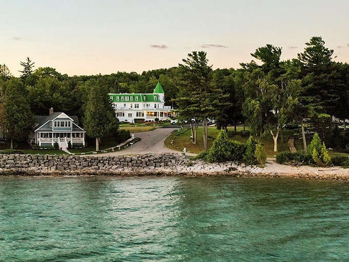 The inn stands like a green-crowned sentinel overlooking the bay, as if keeping watch over your relaxation levels.