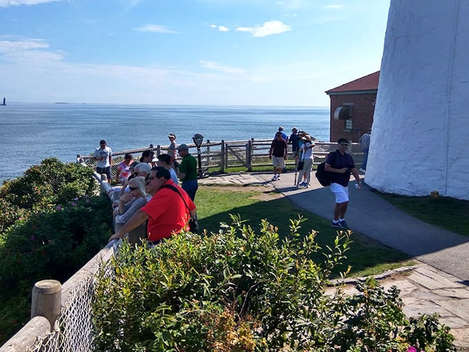 Visitors gather along the viewing area, each experiencing their own moment of connection with this iconic piece of American maritime history.