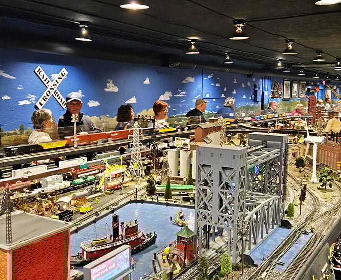 Visitors gather around the display, their faces illuminated by the same childlike wonder regardless of their age.