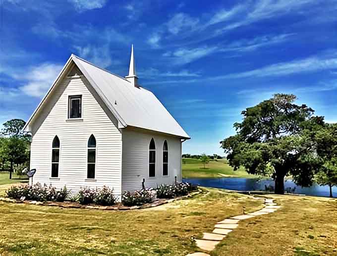 This charming white chapel stands serenely by the water, its simple elegance a reminder that beauty often speaks most clearly through simplicity.