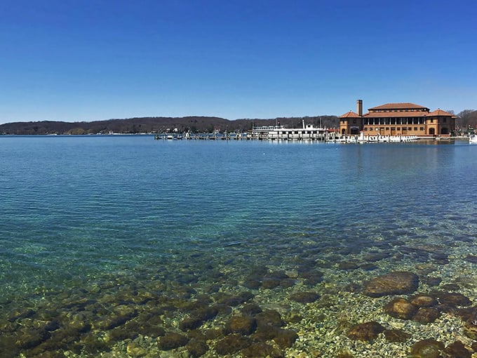 Riviera Beach combines natural beauty with historic charm, as the iconic pavilion watches over swimmers enjoying Geneva Lake's clear waters.