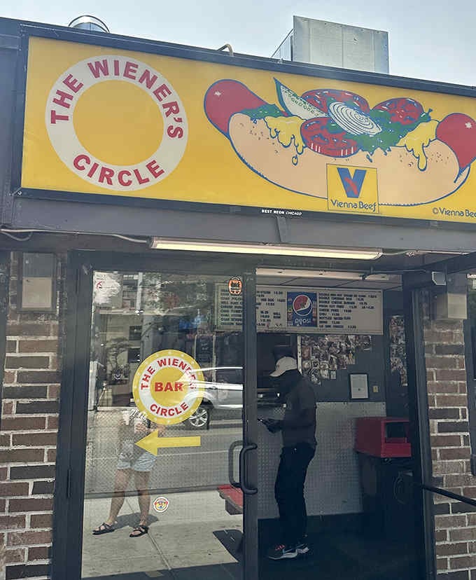 This unassuming hot dog stand holds Chicago food royalty status, serving up perfectly charred dogs and legendary verbal exchanges that keep customers coming back.