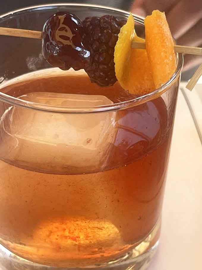 An Old Fashioned garnished with cherries and orange, because sometimes you need something strong before the carbs arrive.