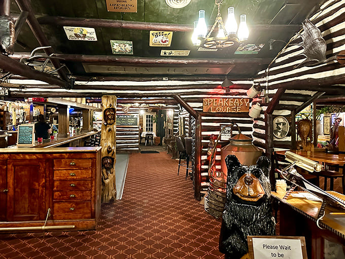The dining room's wagon wheel chandelier and log construction create ambiance that no industrial-chic designer could ever replicate authentically.